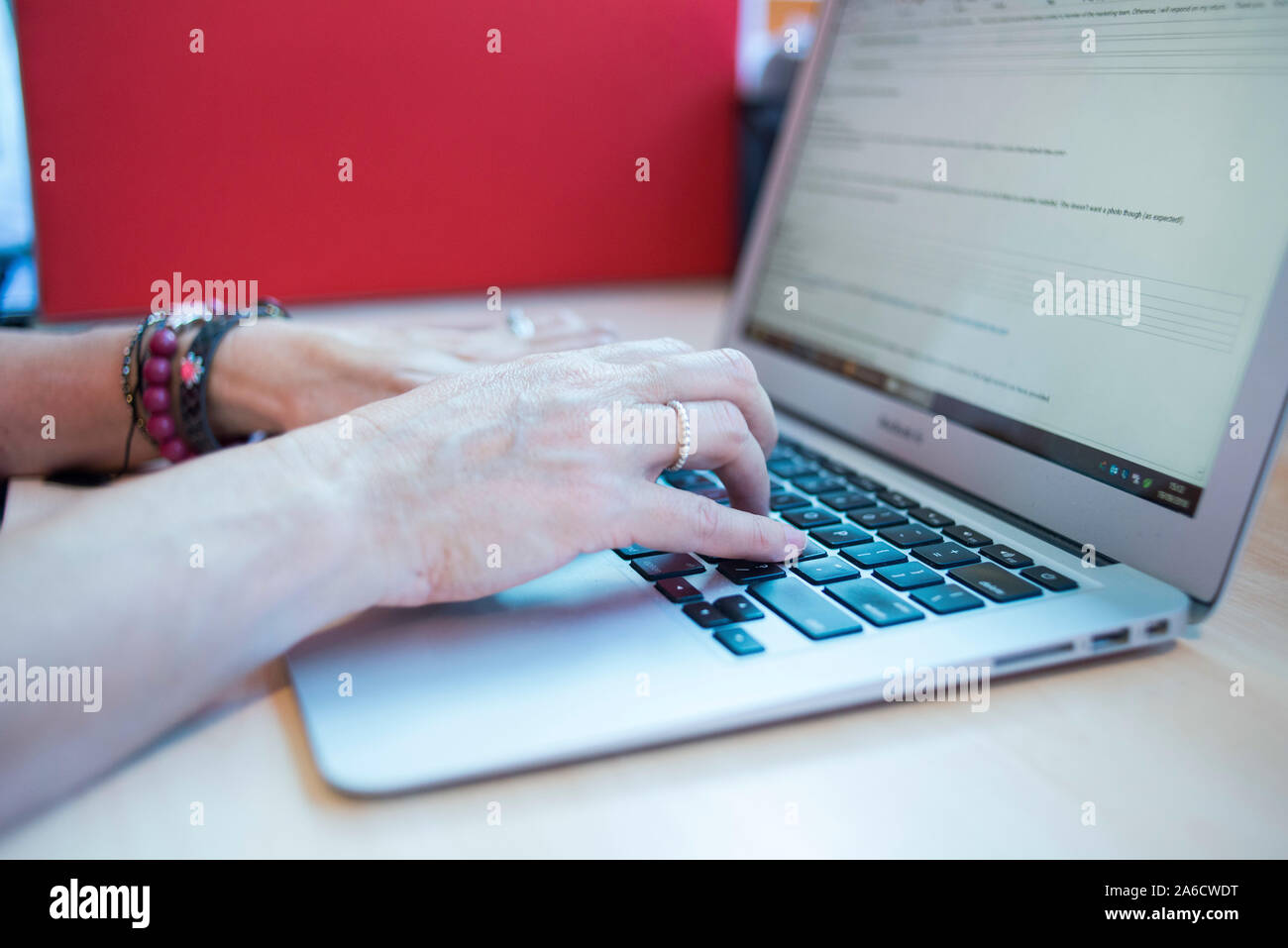 Female hands typing on a lap top keyboard Stock Photo - Alamy