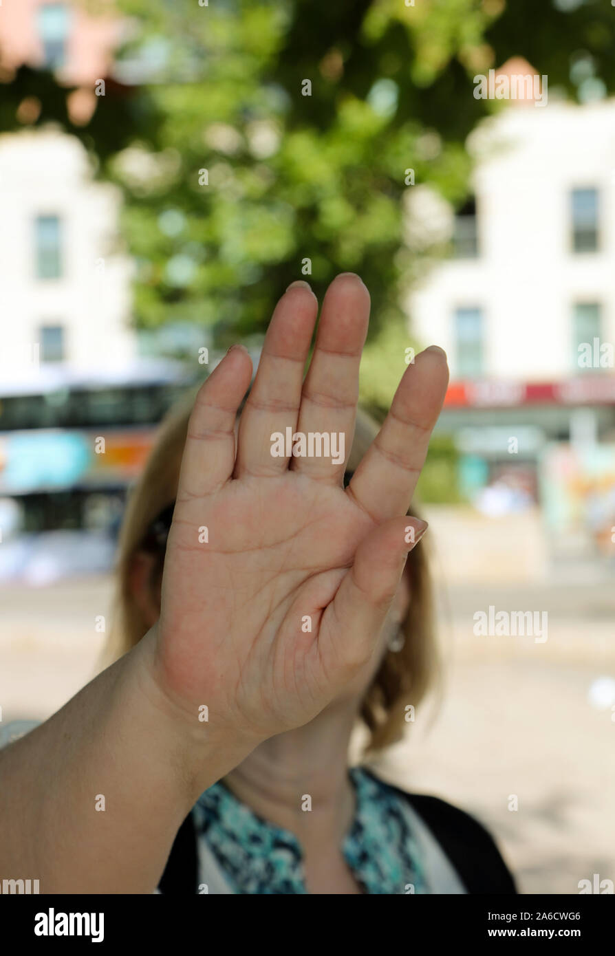 Hand blocking face hi-res stock photography and images - Alamy