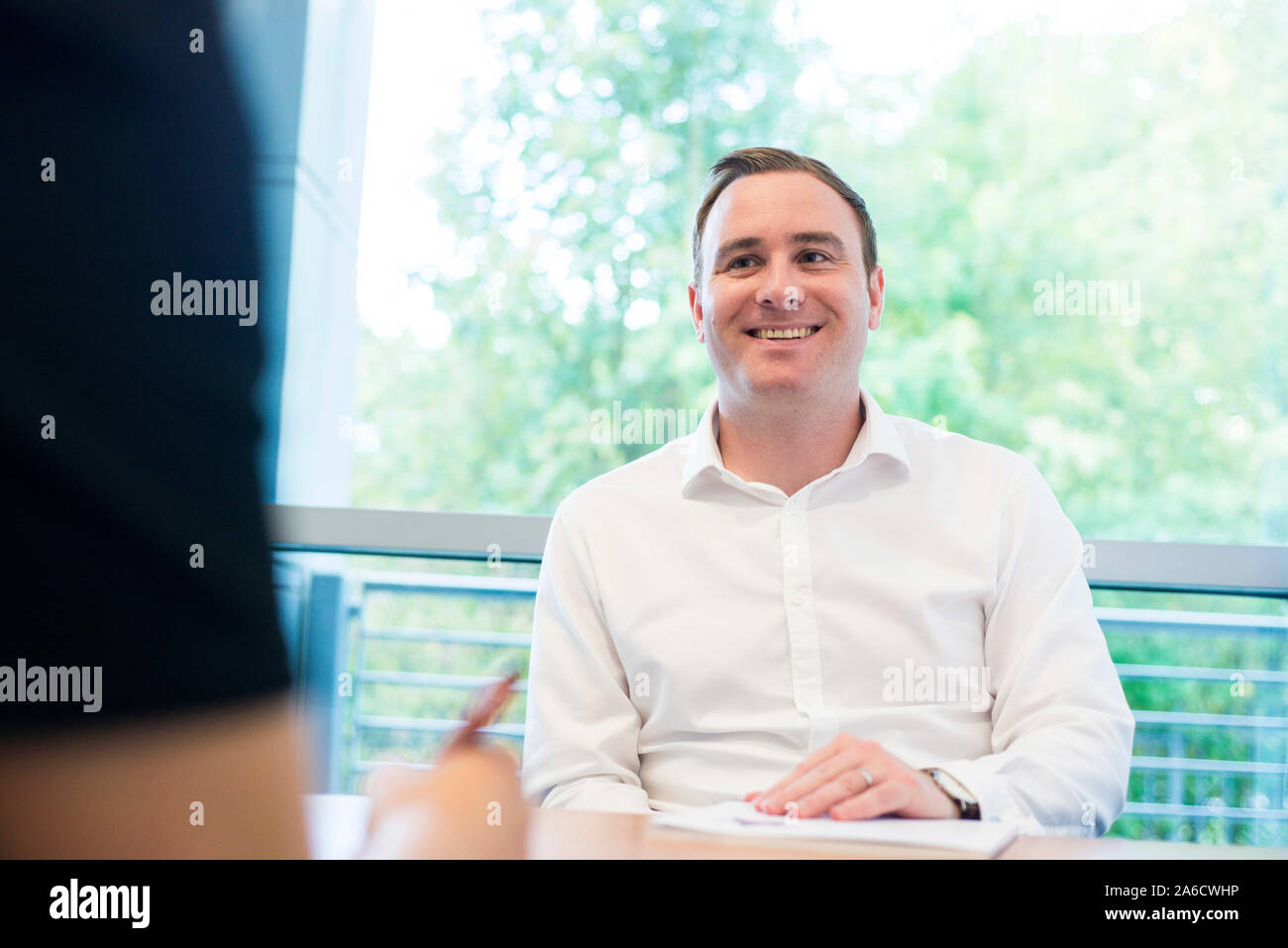 two people sat at a table having a meeting or a job interview Stock ...