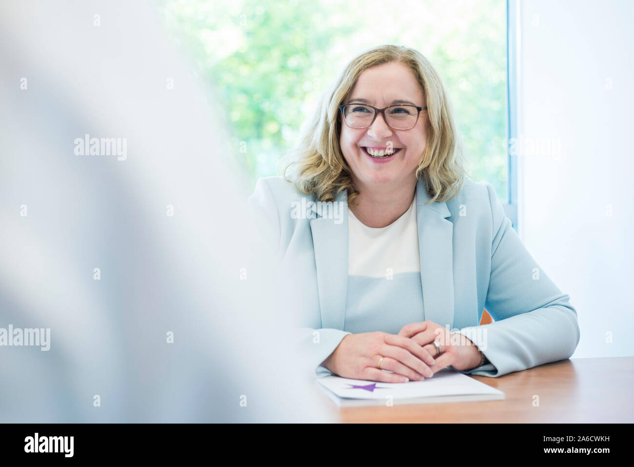 two people sat at a table having a meeting or a job interview Stock ...