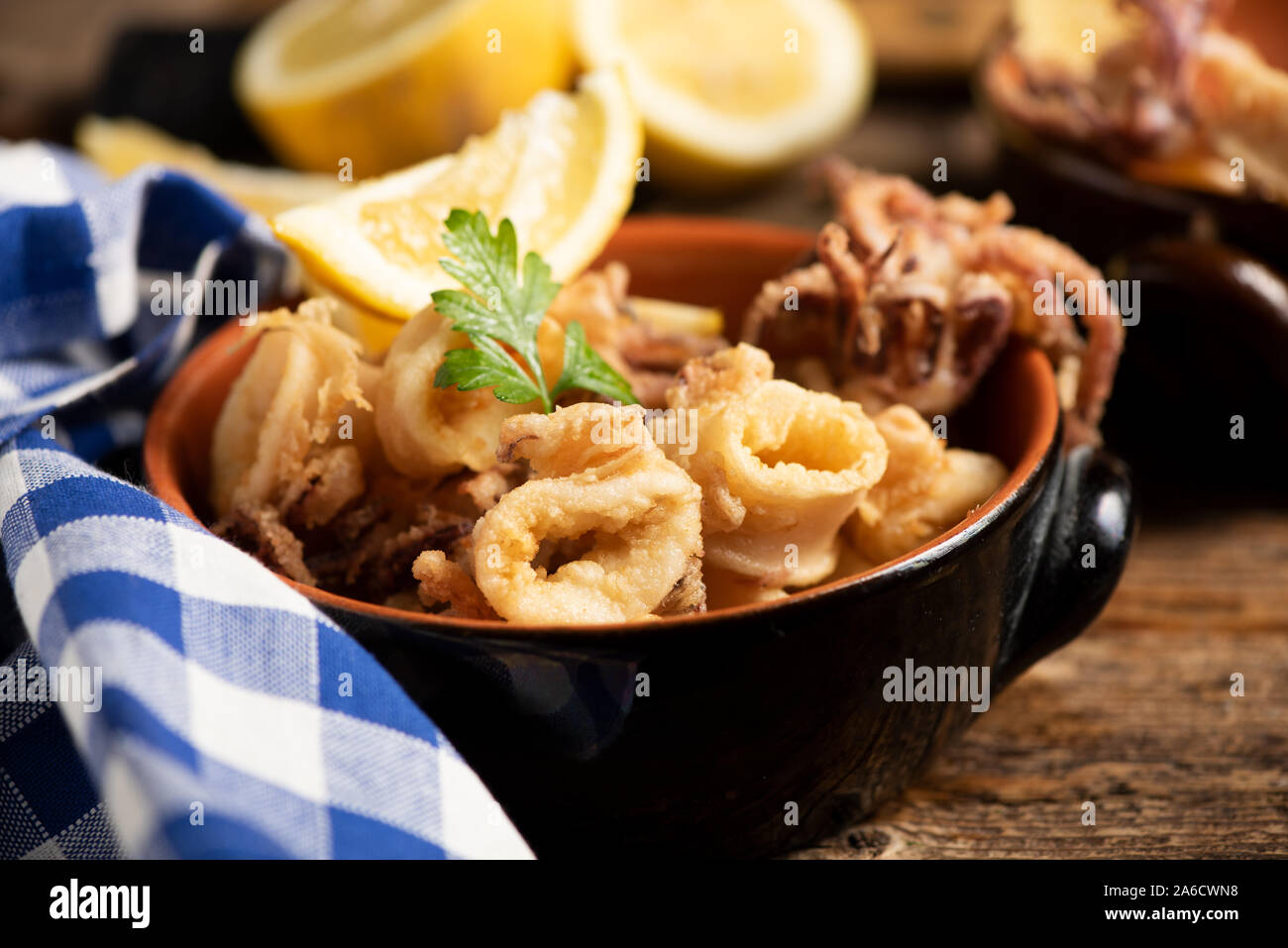 Traditional Italian fried calamari and lemon slice close up Stock Photo ...