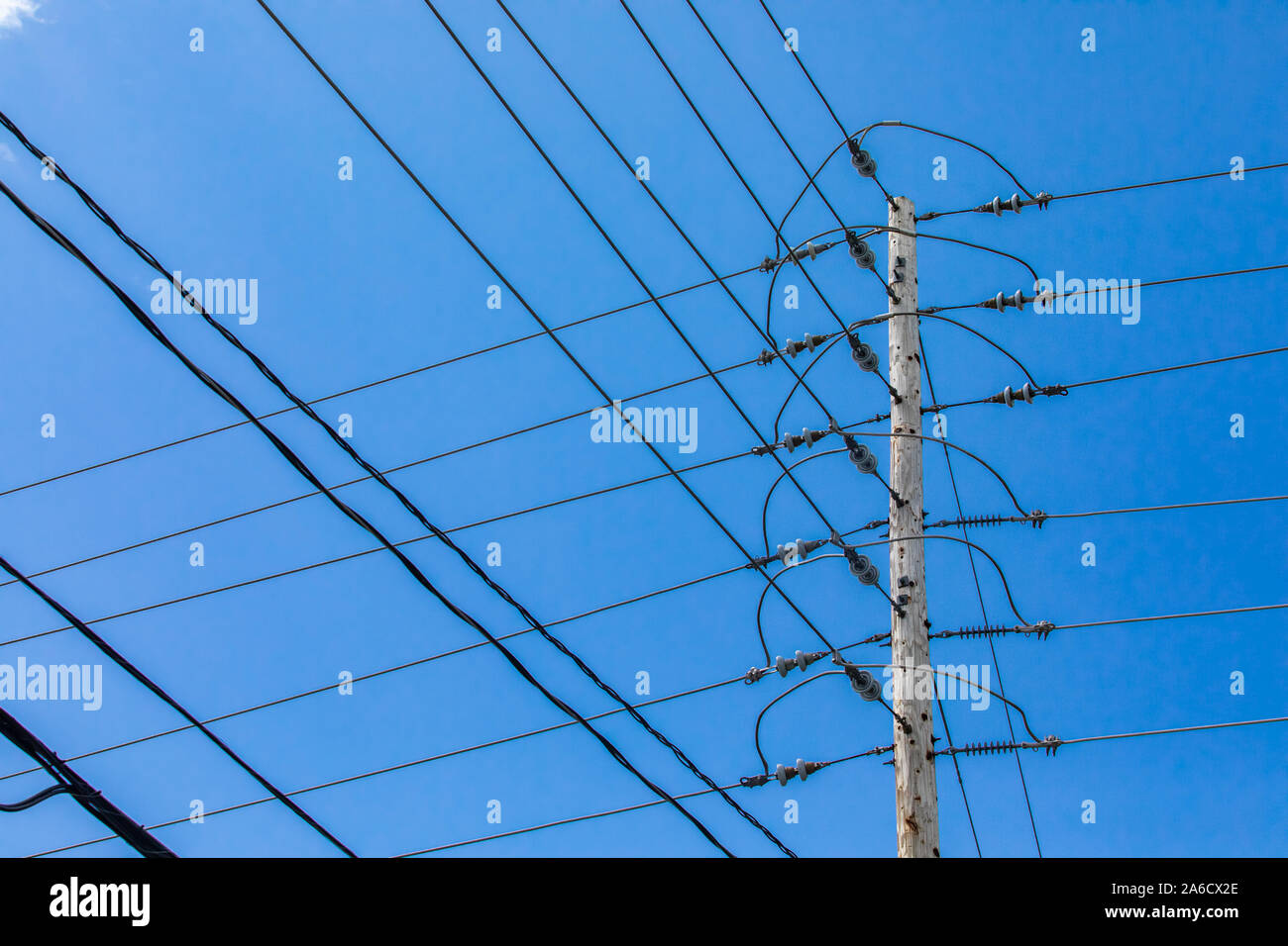 Wooden pole supporting electricity wires hi-res stock photography and ...