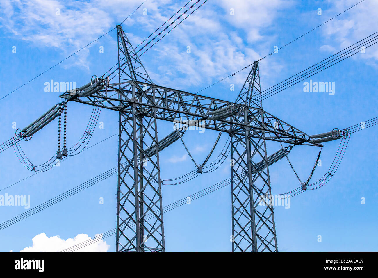 Electric transmission insulators are seen in detail with arcing horns ...