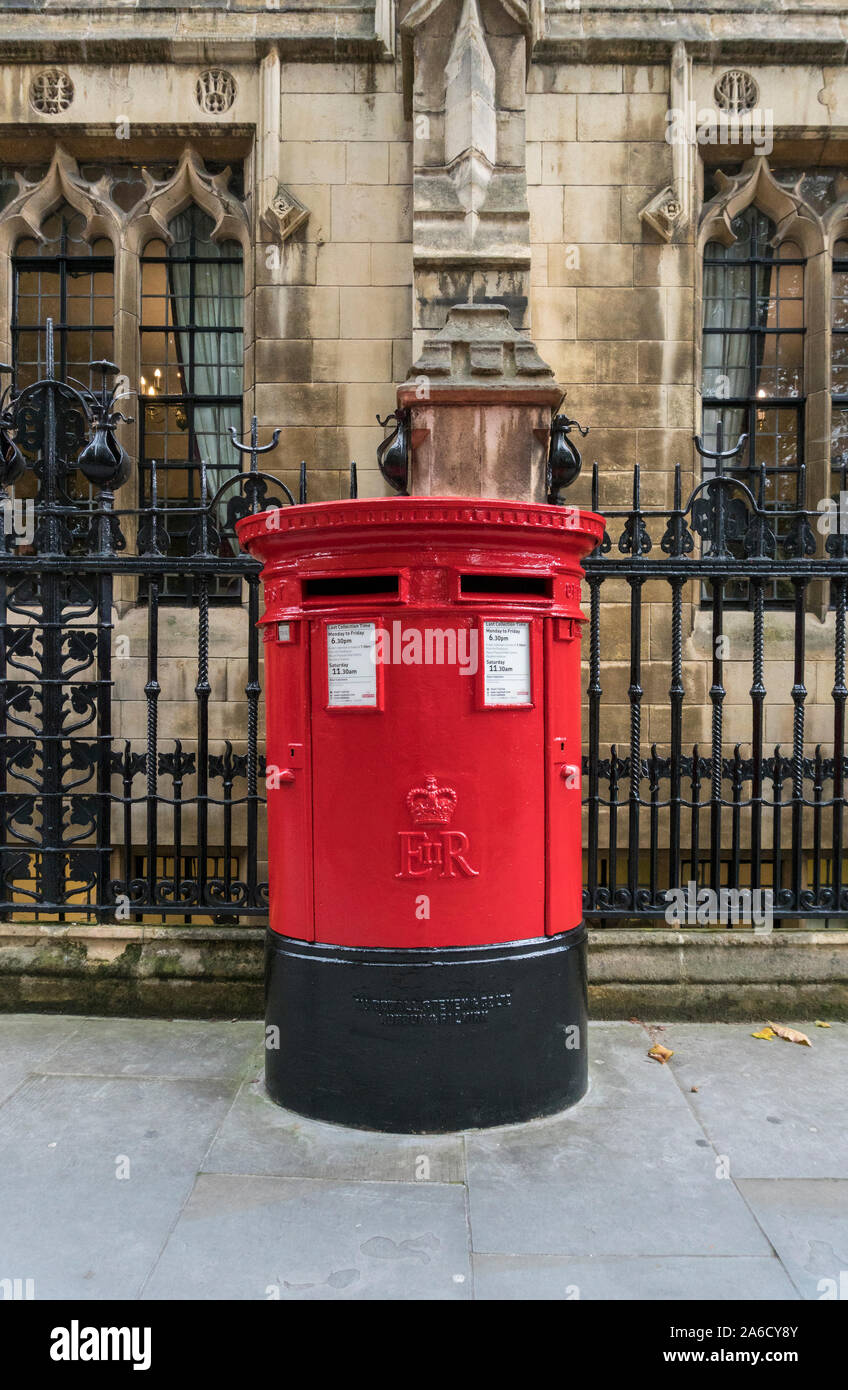 Red british post box in a city street hi-res stock photography and ...
