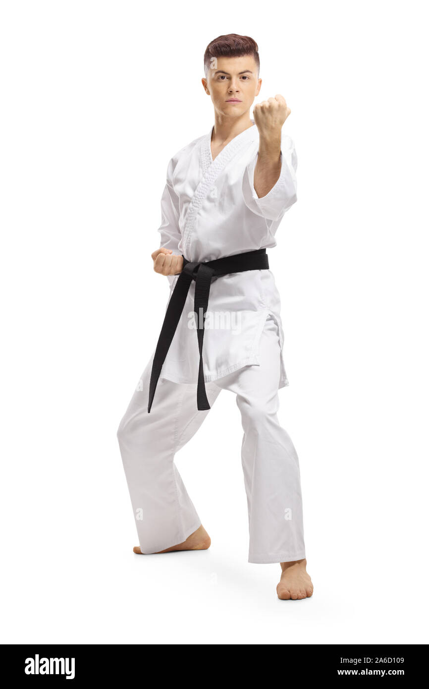 Full length portrait of a young man practicing katrate isolated on ...