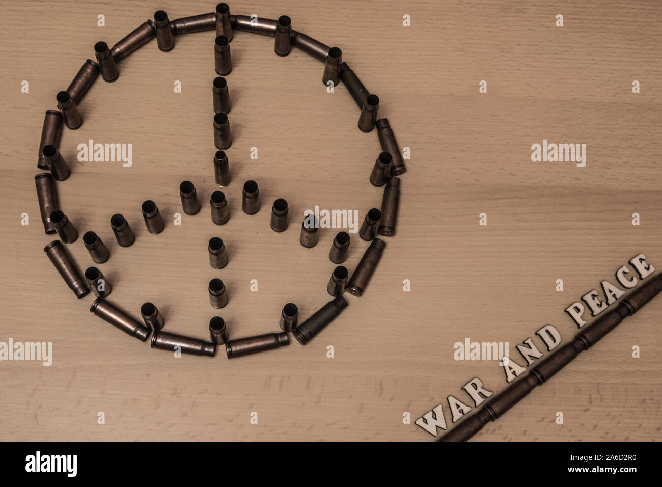 Symbol of peace made from the shells of military rifle with the ...