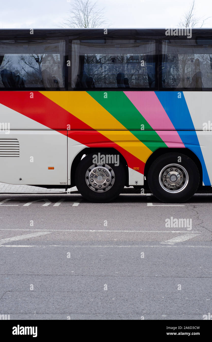 A colorful rainbow print on a bus in London, England Stock Photo - Alamy