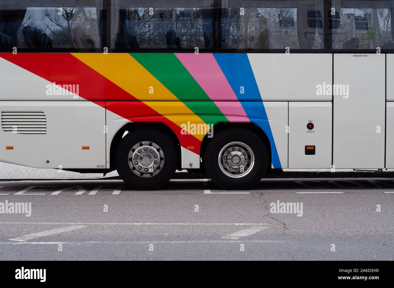 A colorful rainbow print on a bus in London, England Stock Photo - Alamy