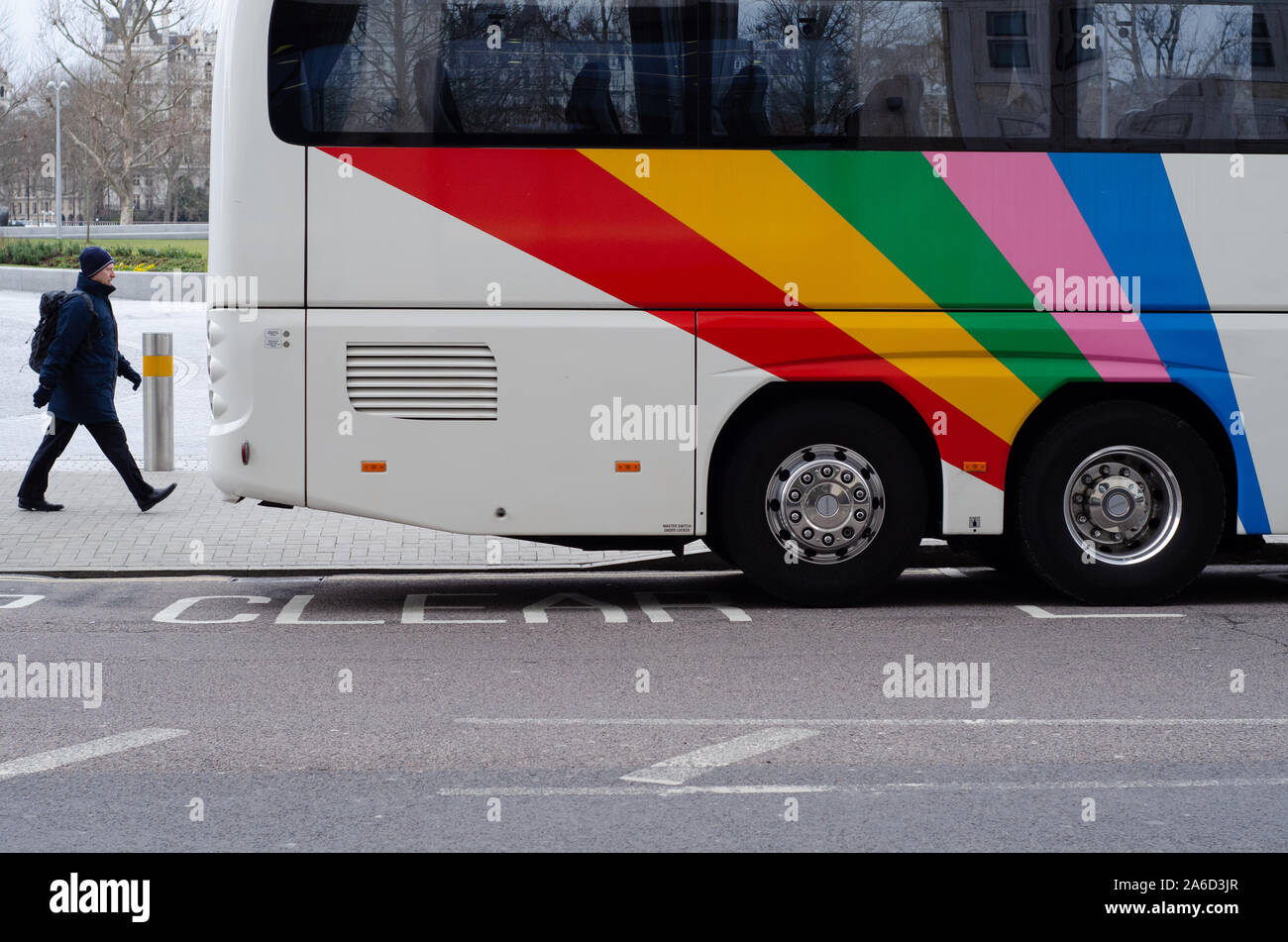 A colorful rainbow print on a bus in London, England Stock Photo - Alamy