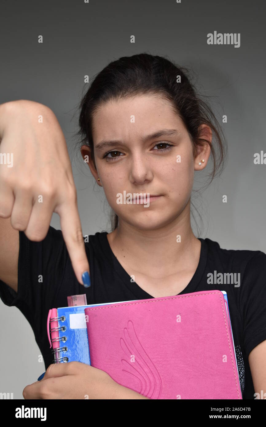 Hispanic Female Student Pointing Stock Photo - Alamy
