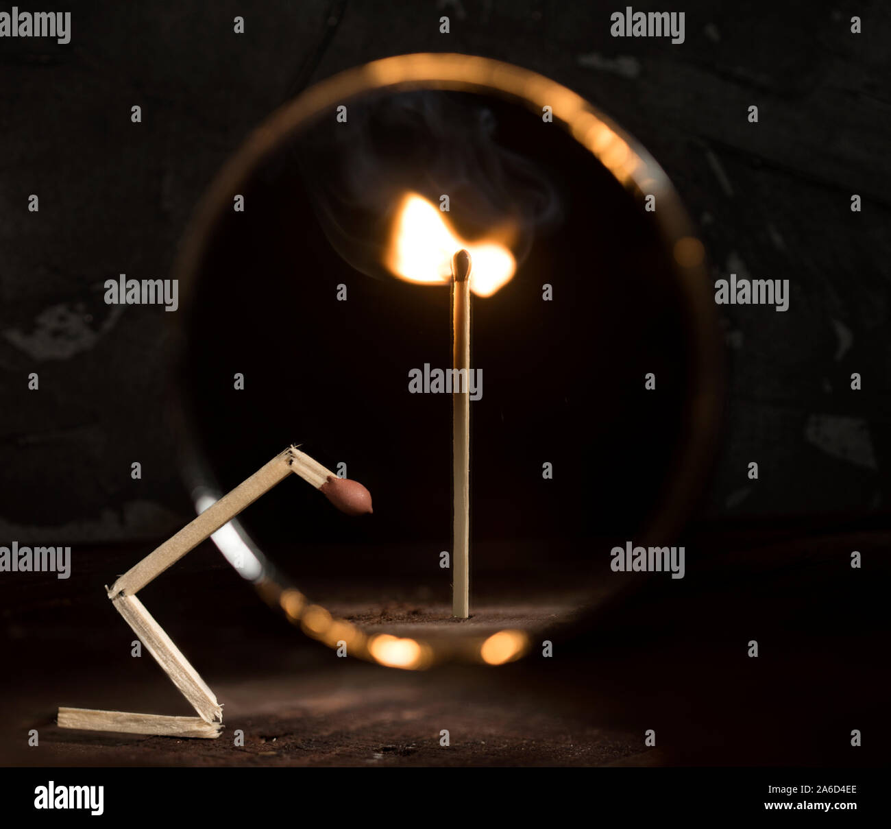 Broken match is against the mirror and the reflection shows a whole ...