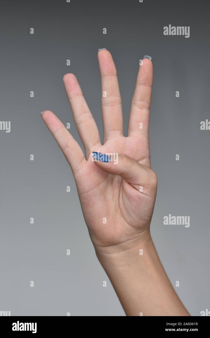Female Teen Hand Counting Four Stock Photo - Alamy