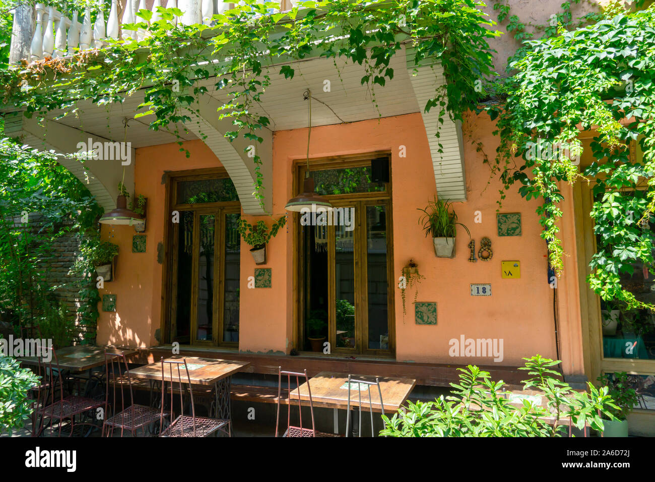 Beautiful orange colored balcony is covered with grape branches Stock ...