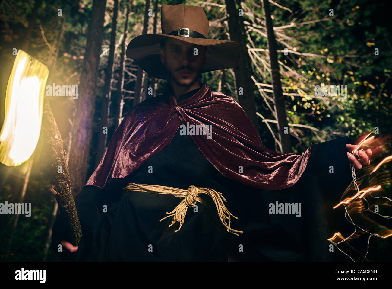 Guy wearing fantasy magician halloween costume and performing magic ...