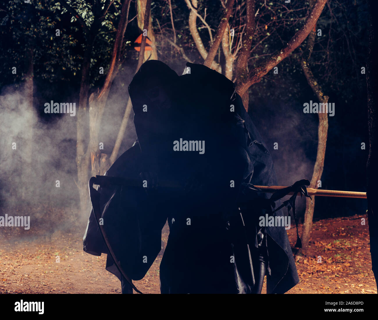 Grim Reaper standing in the fog at night with his scythe Stock Photo ...