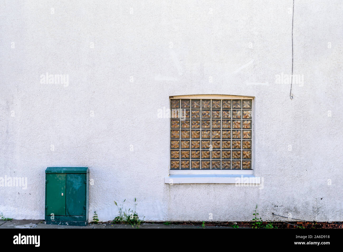 white stone wall with glass window in england Stock Photo - Alamy