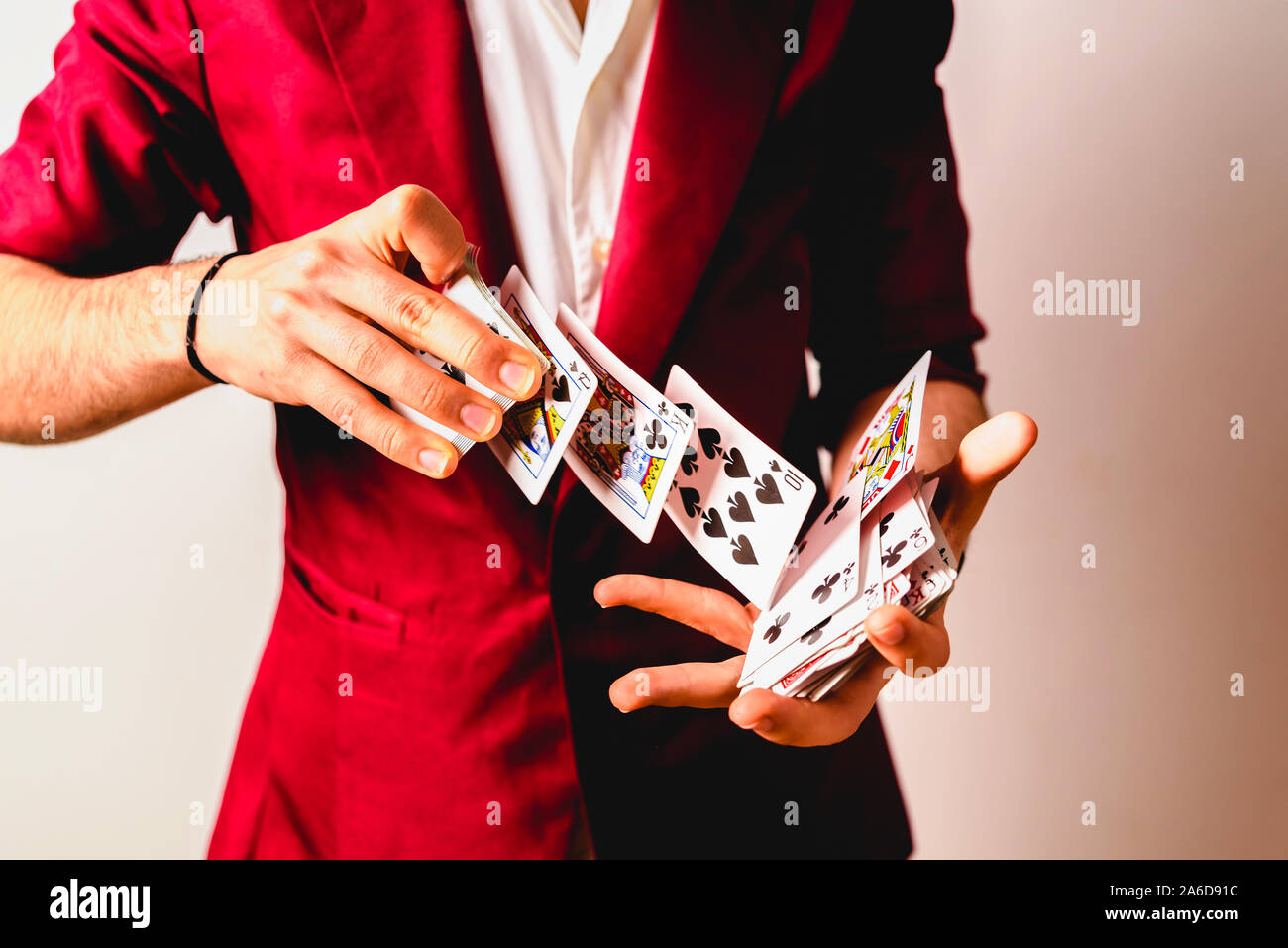 Hands of magician doing tricks with a deck of cards Stock Photo - Alamy
