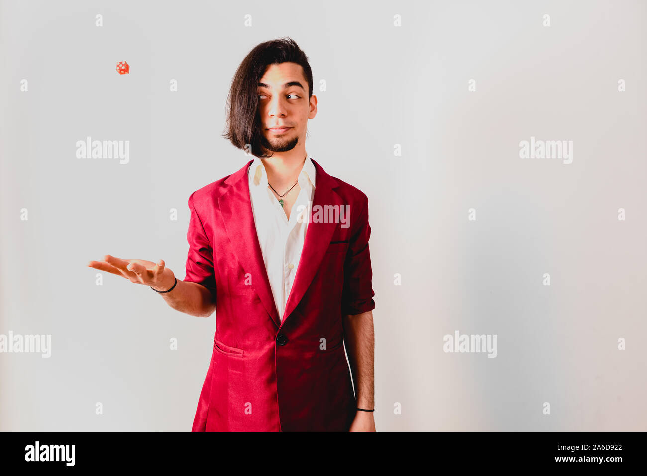 Young magician juggling a deck of playing cards Stock Photo - Alamy