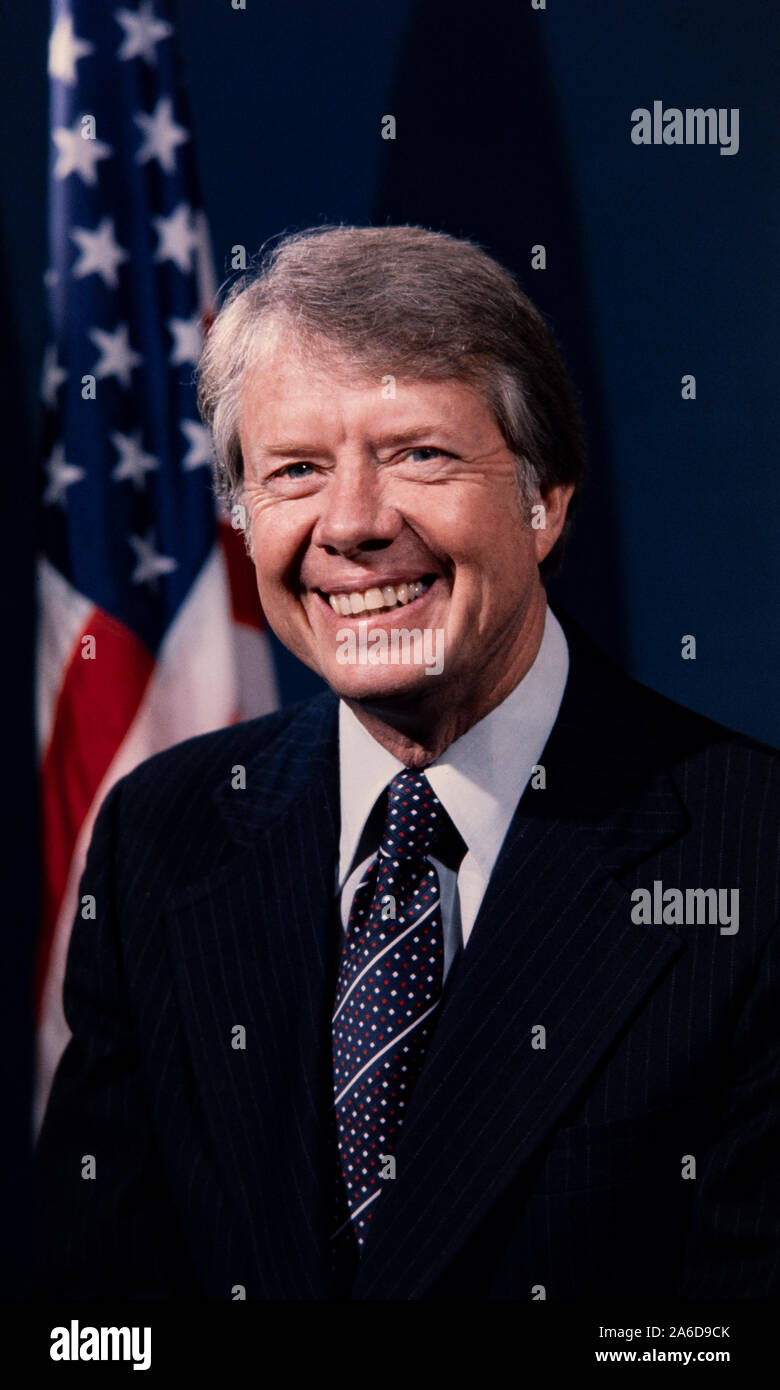 Portrait of President Jimmy Carter in dark suit with US flag in ...