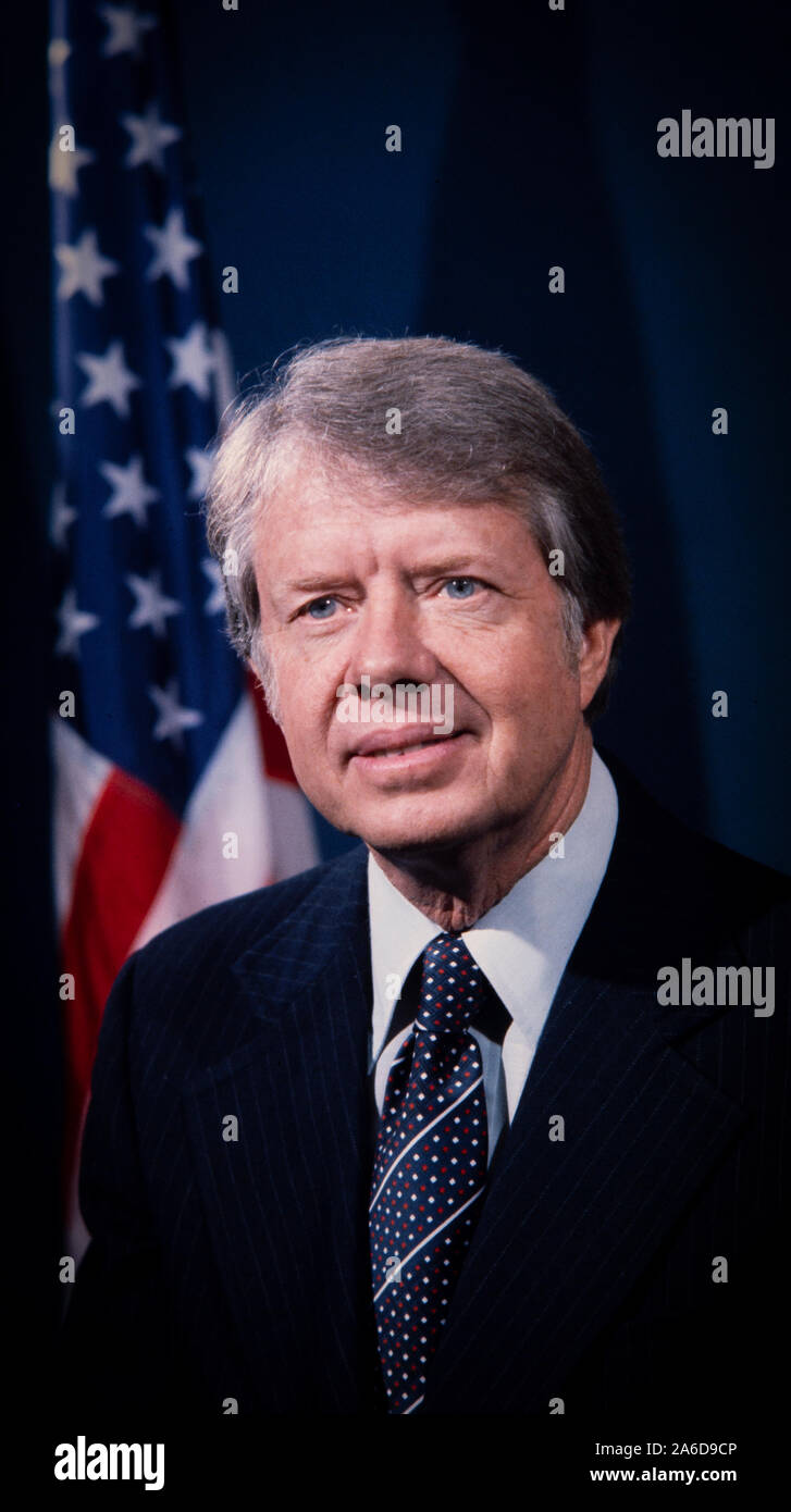 Portrait of President Jimmy Carter in dark suit with US flag in ...
