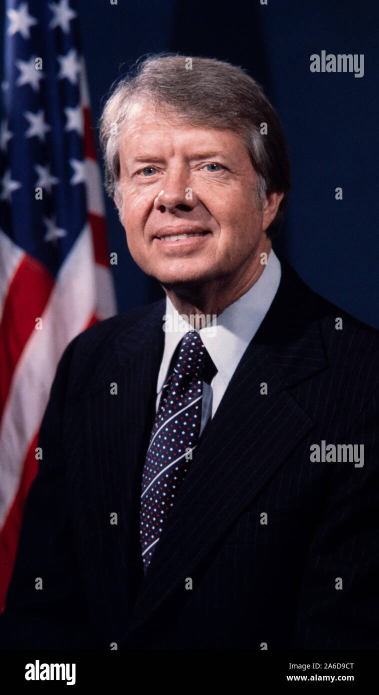 Portrait of President Jimmy Carter in dark suit with US flag in ...