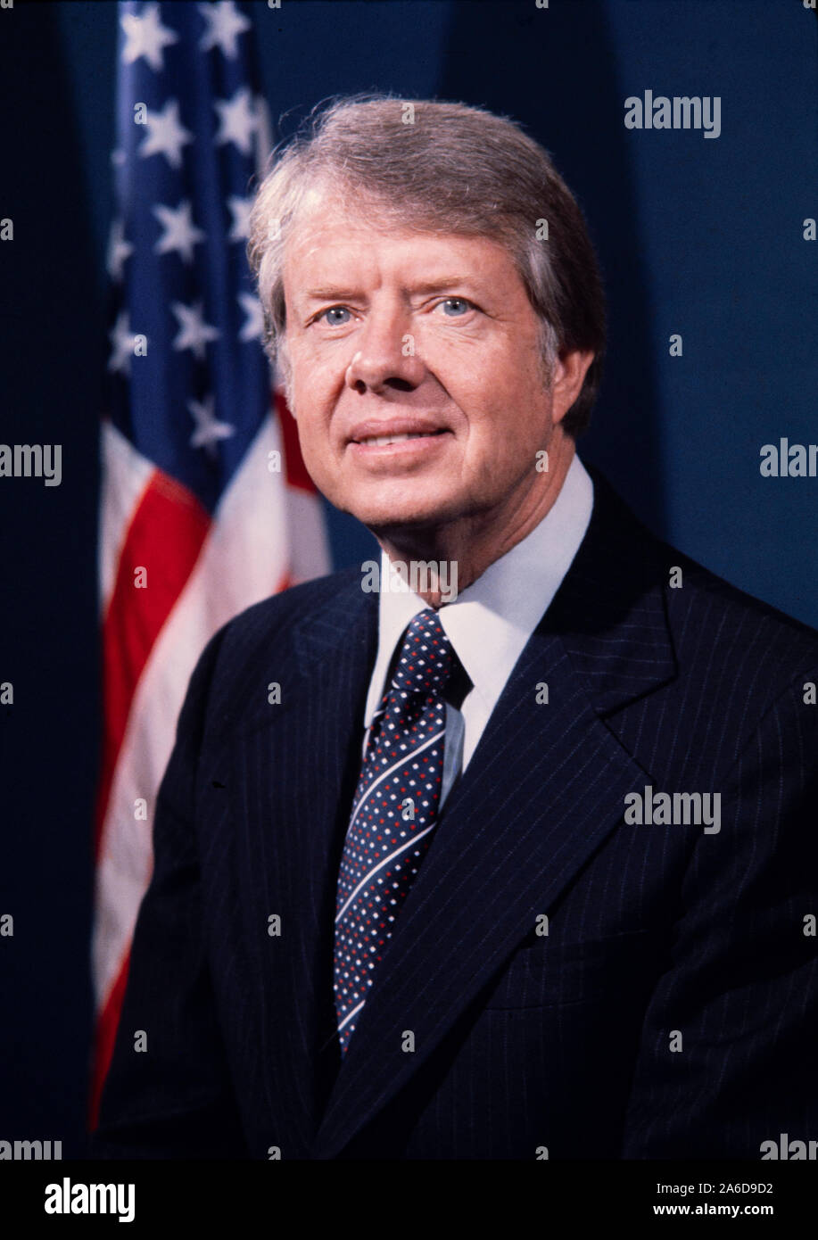 Portrait of President Jimmy Carter in dark suit with US flag in ...