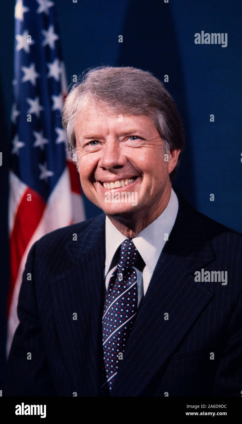 Portrait of President Jimmy Carter in dark suit with US flag in ...