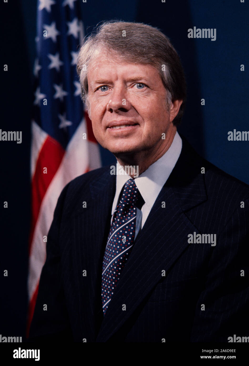 Portrait of President Jimmy Carter in dark suit with US flag in ...