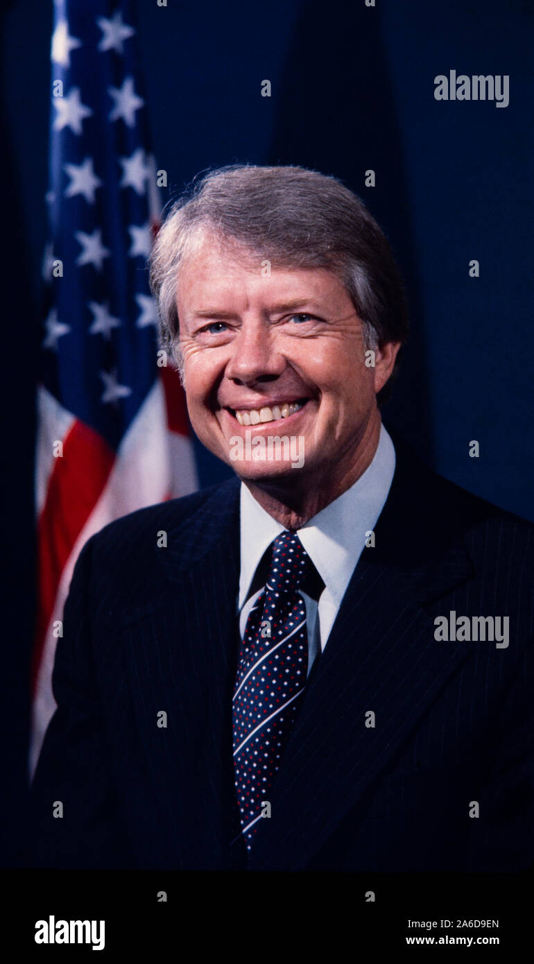 Portrait of President Jimmy Carter in dark suit with US flag in ...