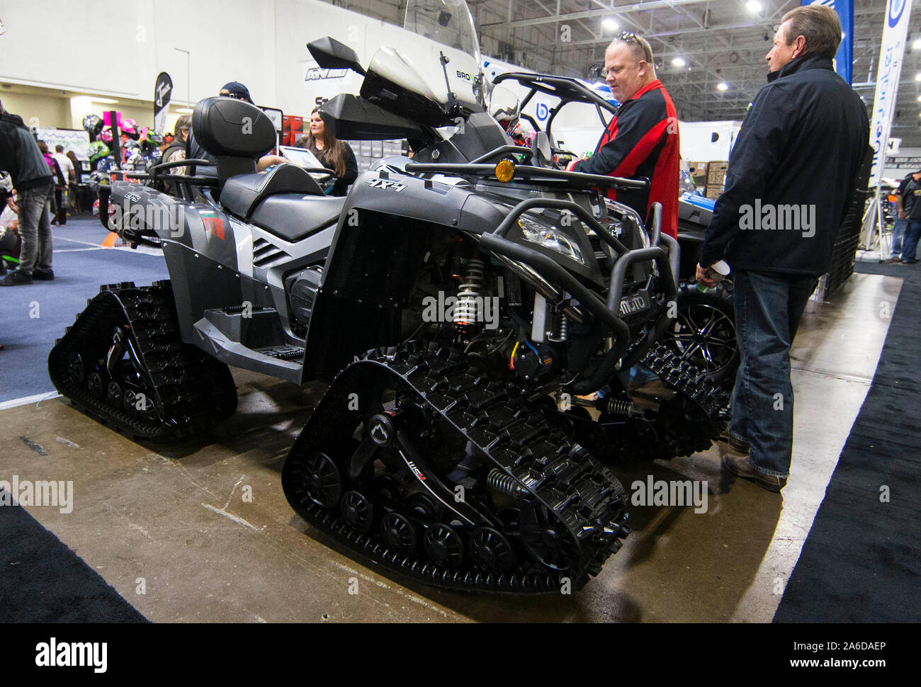 Toronto, Canada. 25th Oct, 2019. People look at a CF Moto all-terrain ...