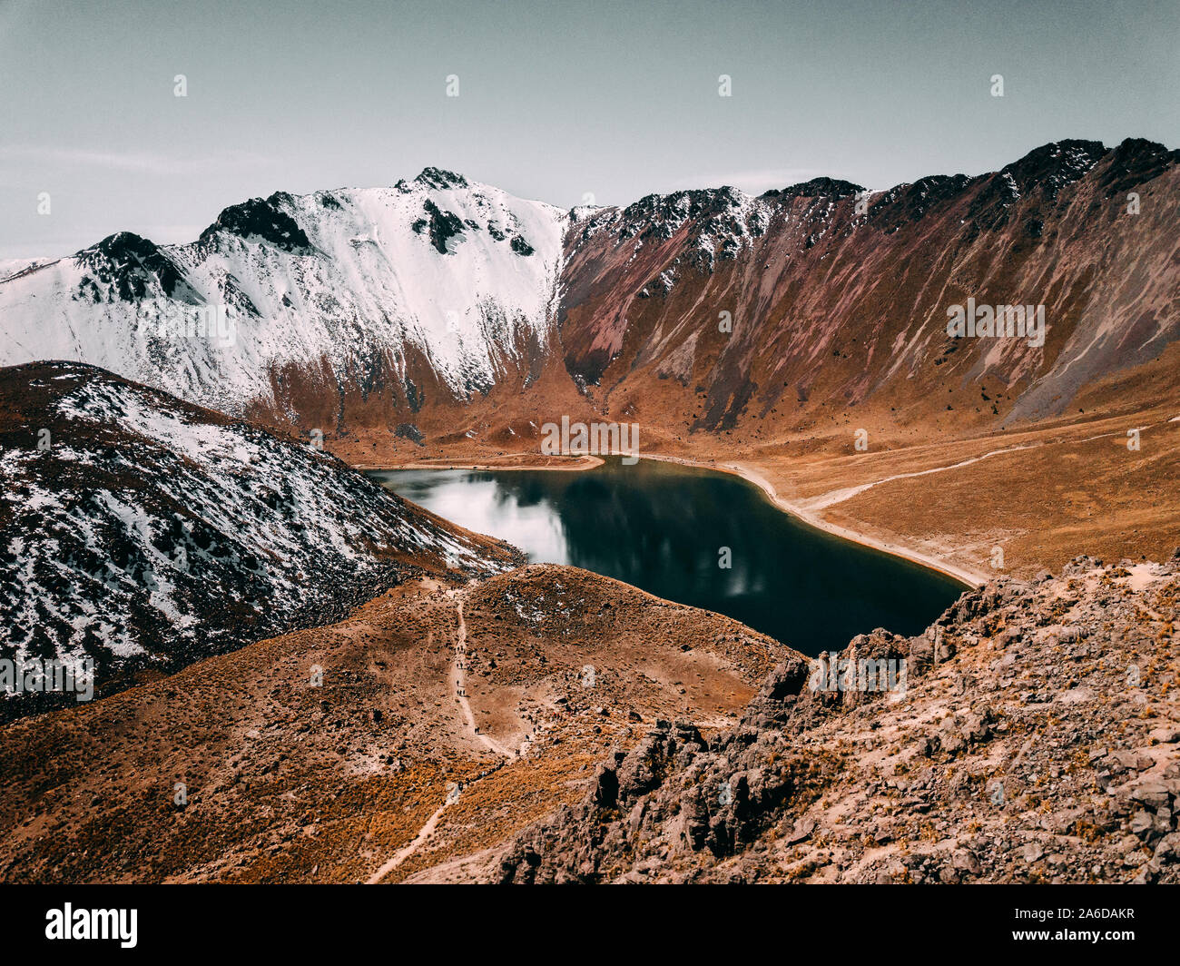 Landscape shot featuring the crater, lakes and snow covered slopes on ...