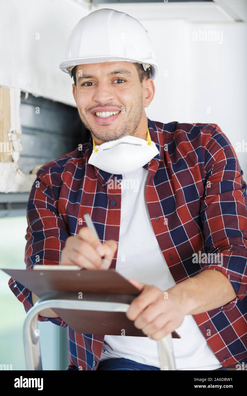 a happy smiling construction inspector Stock Photo - Alamy