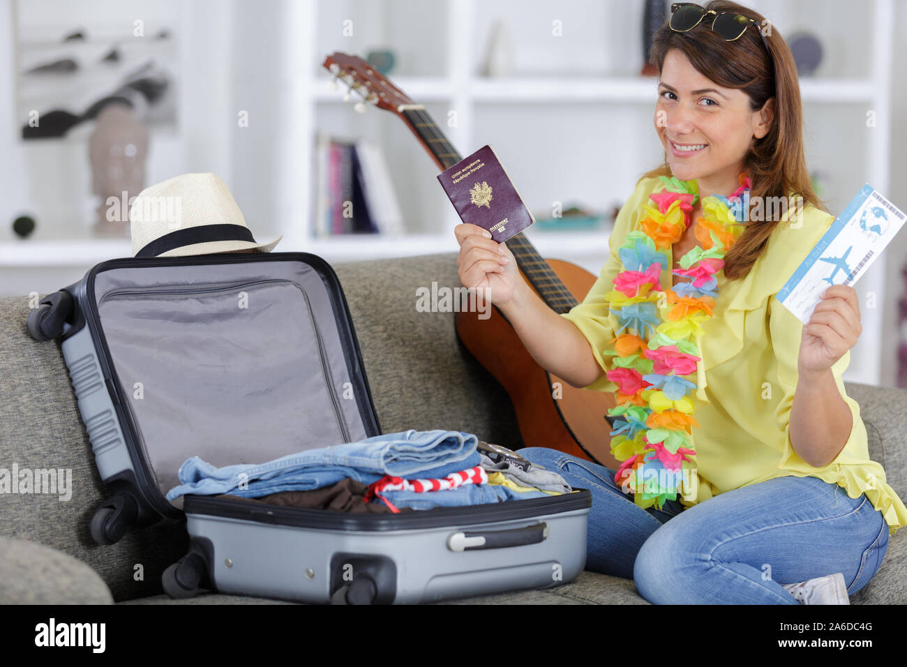 happy woman showing passporte and ticket Stock Photo - Alamy