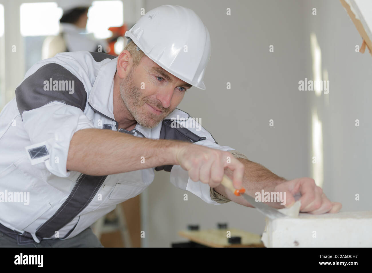 worker applying plaster with a spatula Stock Photo - Alamy