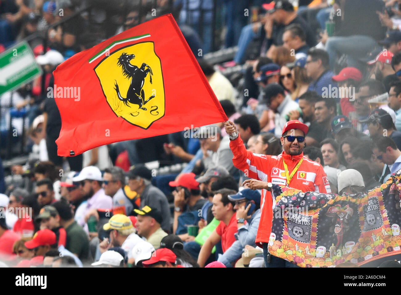 Mexico City. 25th Oct, 2019. A Ferrari's fan waves the flag during the ...