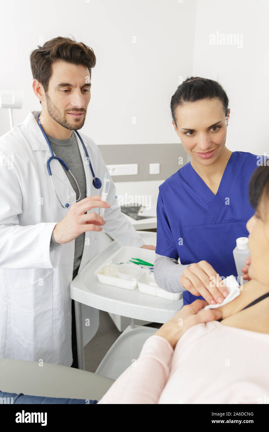 dentist curing a female patient Stock Photo - Alamy
