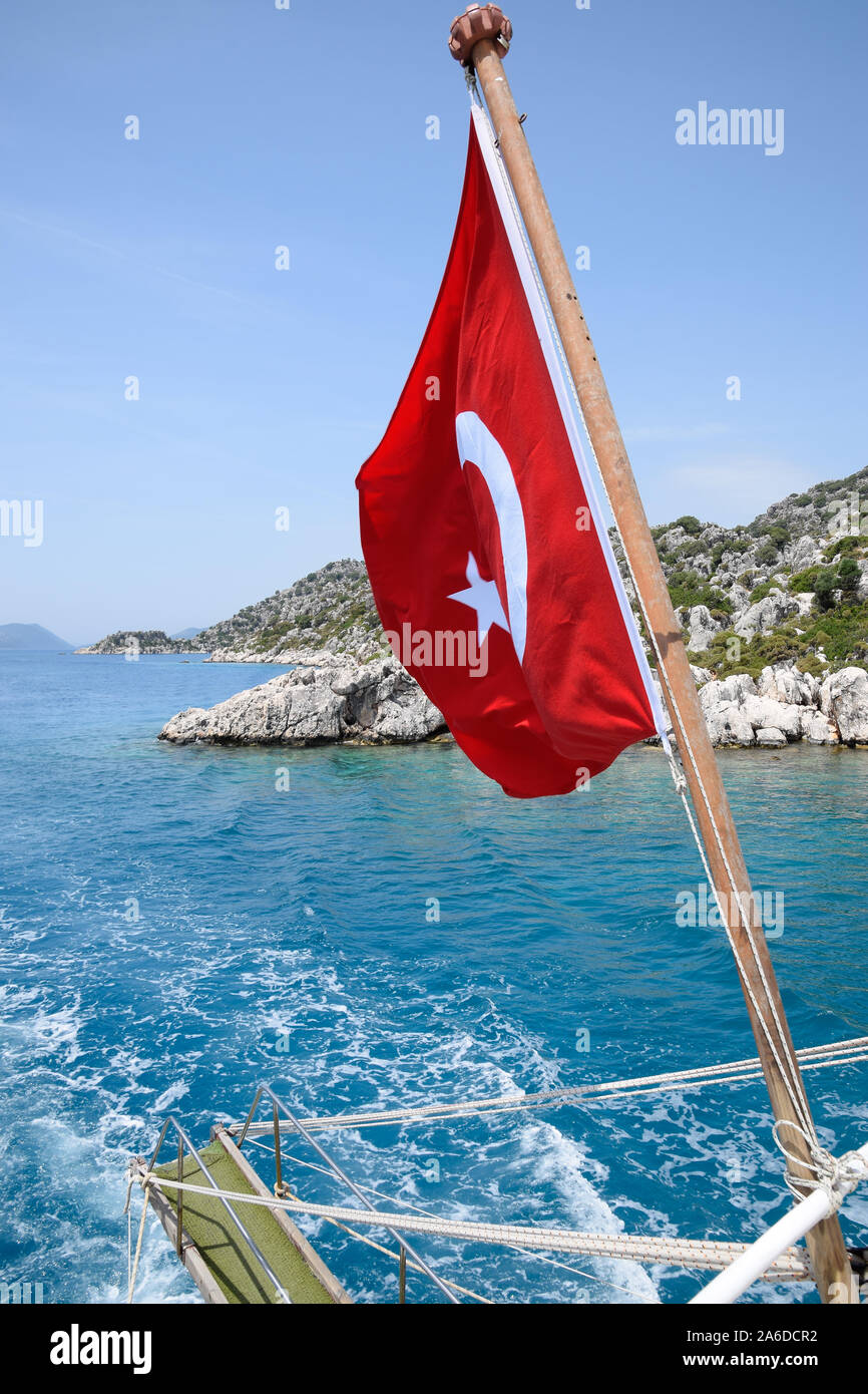 Turkey flag at the stern of a pleasure yacht. View of the Mediterranean ...