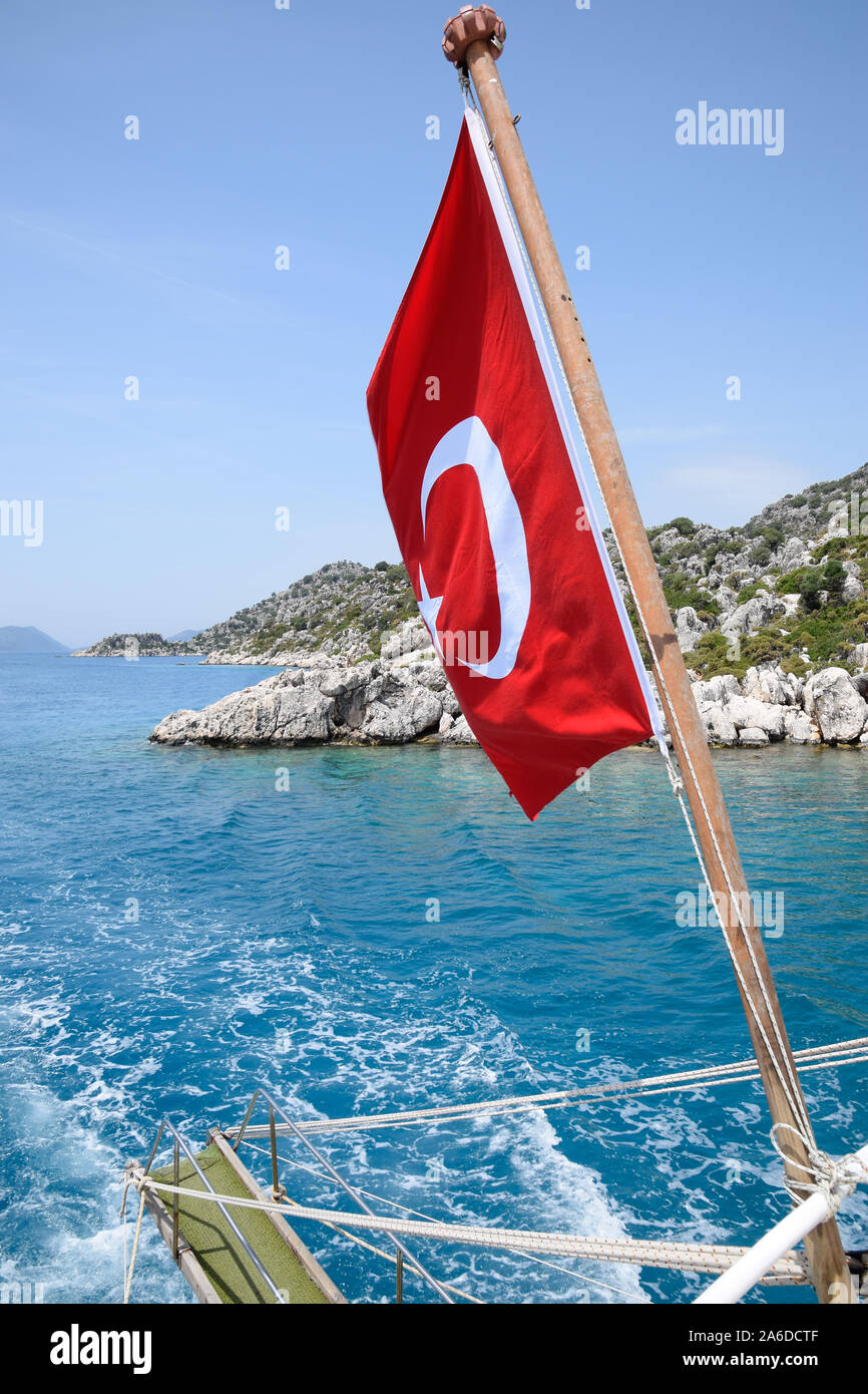 Turkey flag at the stern of a pleasure yacht. View of the Mediterranean ...
