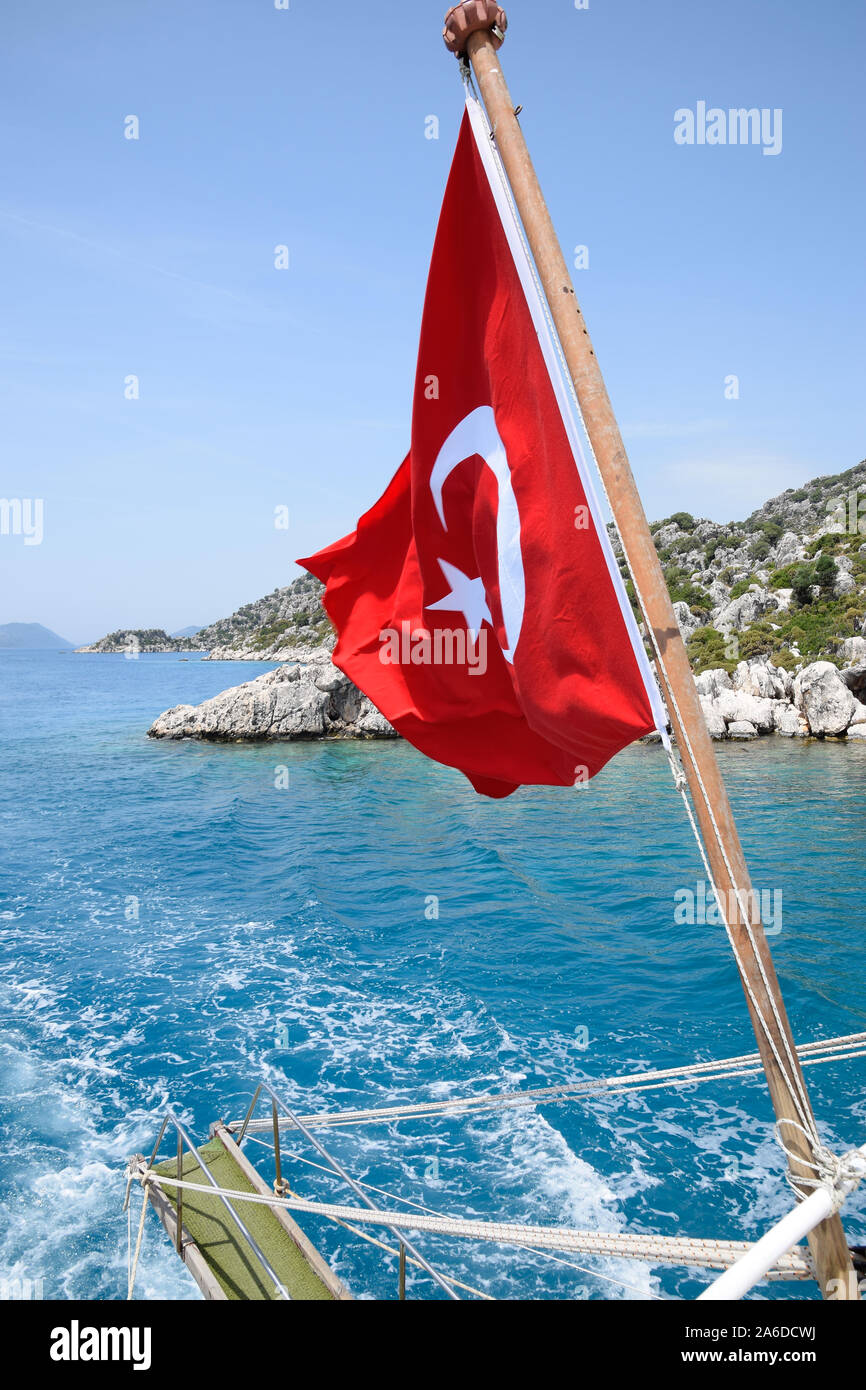Turkey flag at the stern of a pleasure yacht. View of the Mediterranean ...