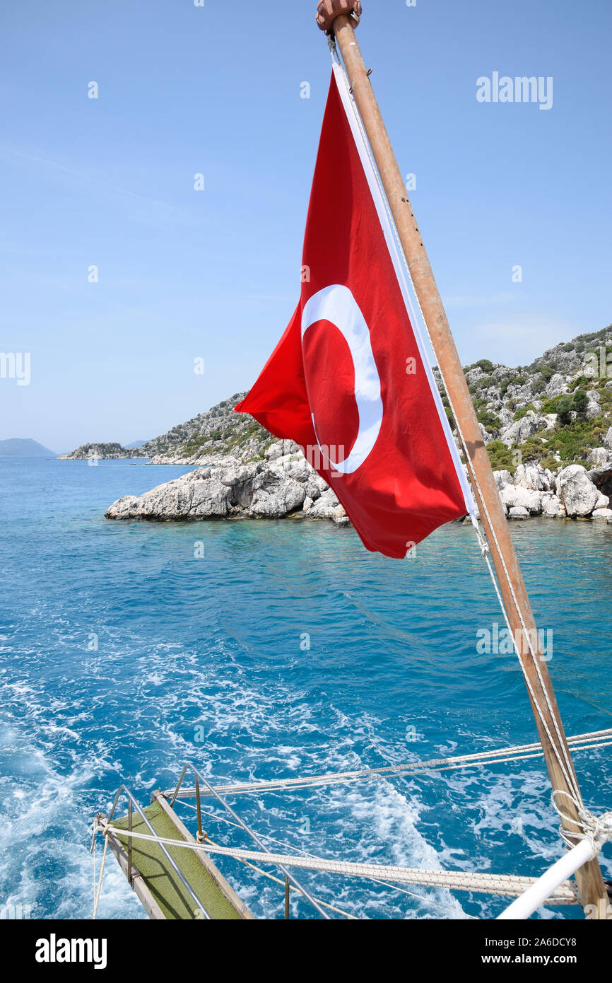 Turkey flag at the stern of a pleasure yacht. View of the Mediterranean ...