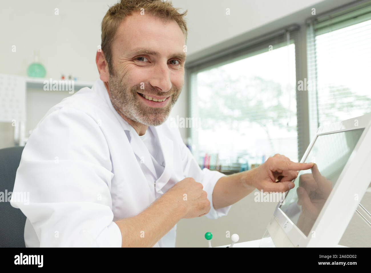 male scientist using touchscreen computer Stock Photo - Alamy