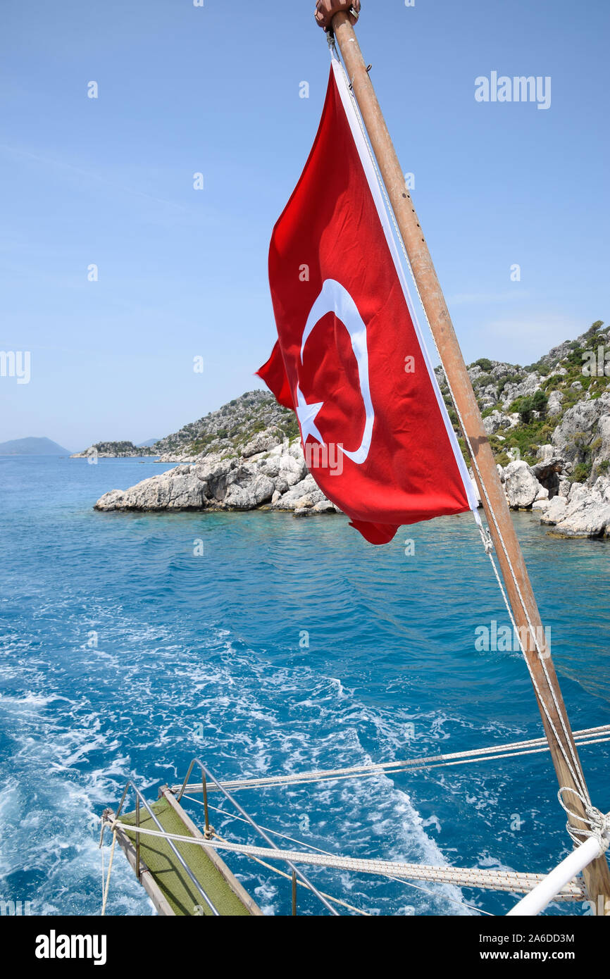 Turkey flag at the stern of a pleasure yacht. View of the Mediterranean ...