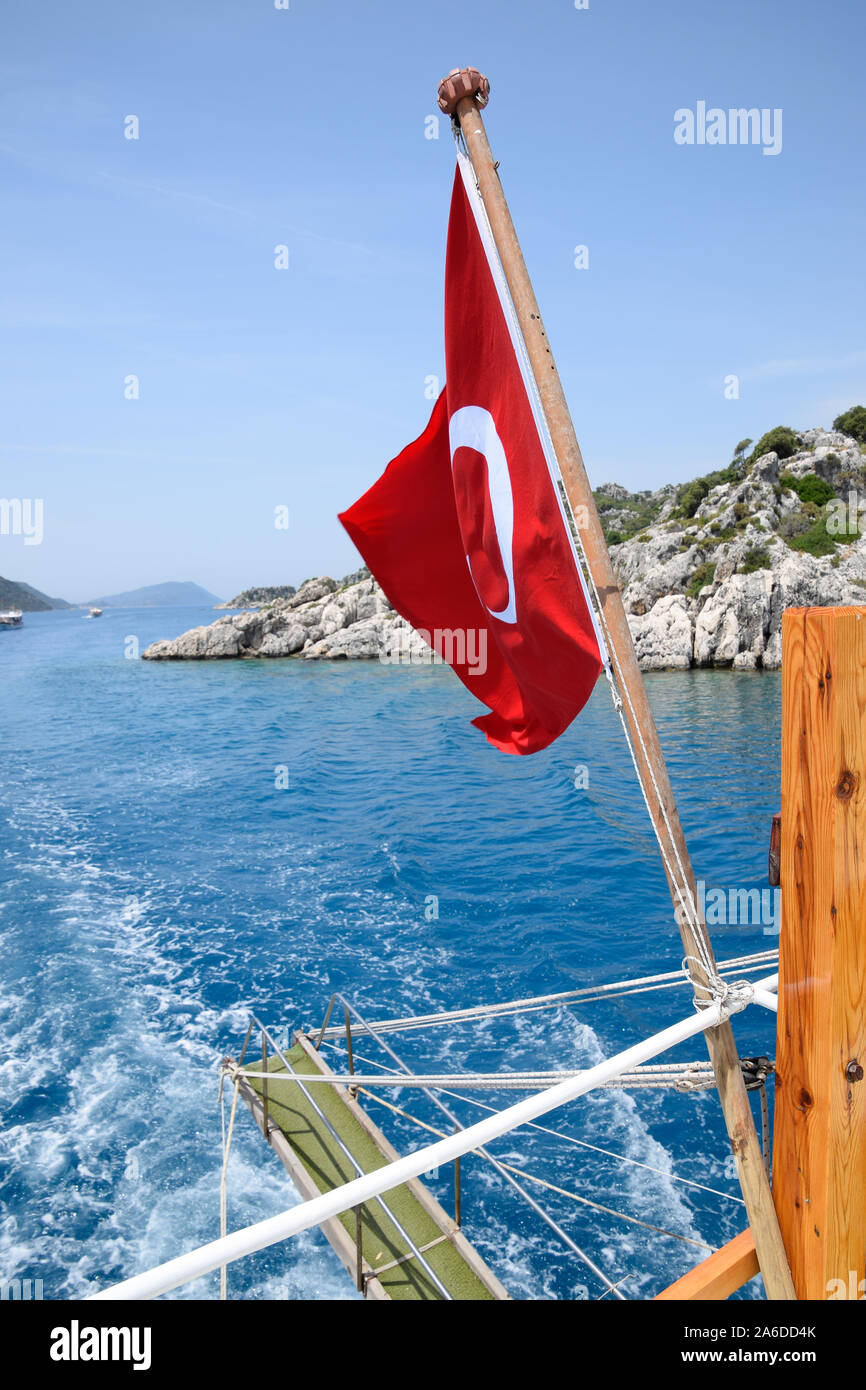 Turkey flag at the stern of a pleasure yacht. View of the Mediterranean ...