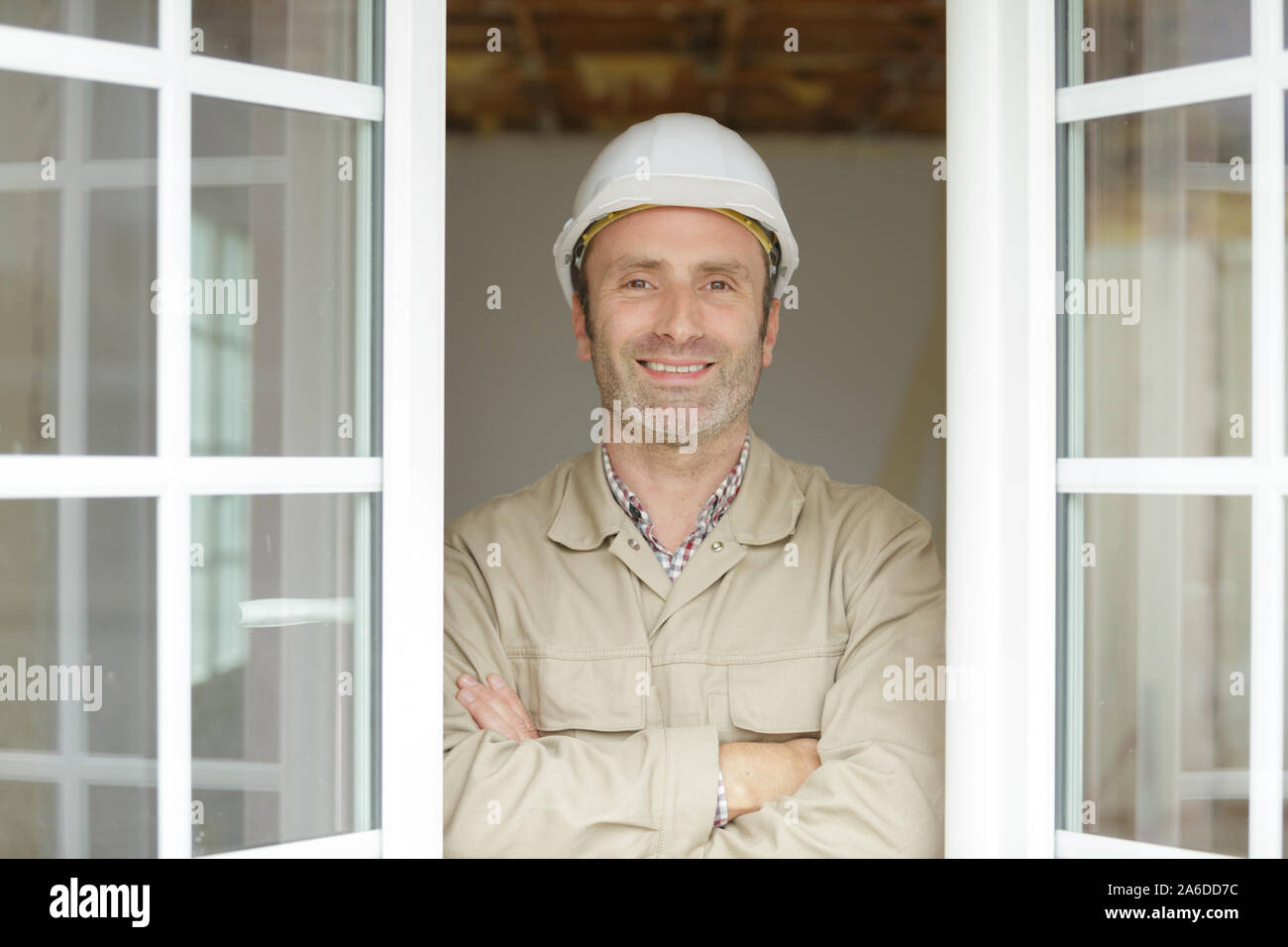 window builder working on mount of new installation Stock Photo - Alamy