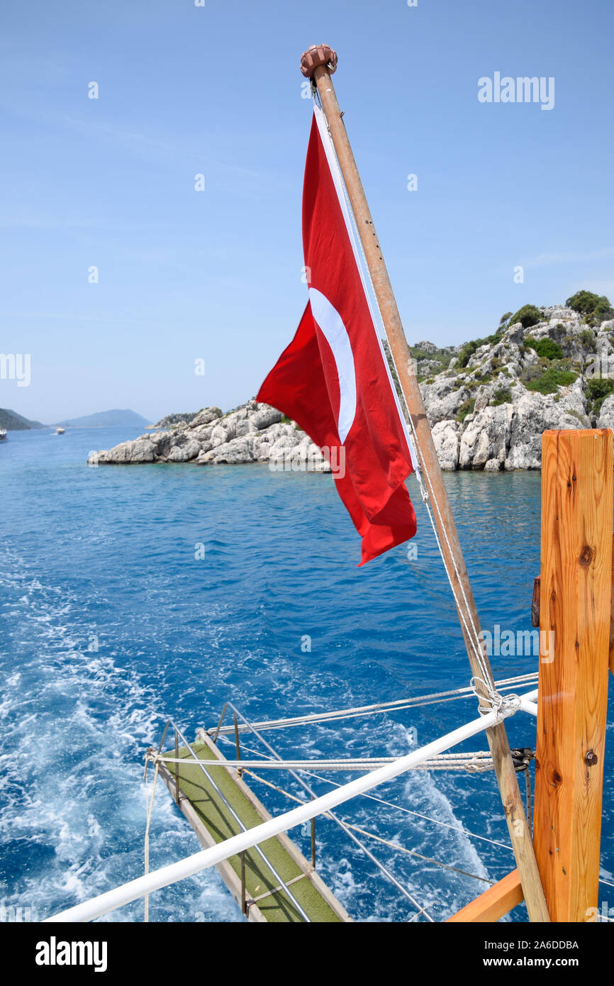 Turkey flag at the stern of a pleasure yacht. View of the Mediterranean ...