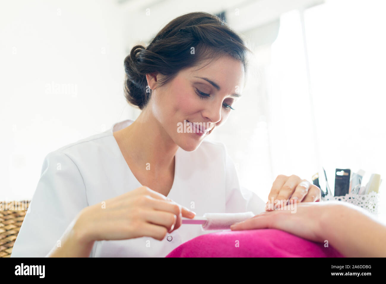 Young woman painting fingernails hi-res stock photography and images ...