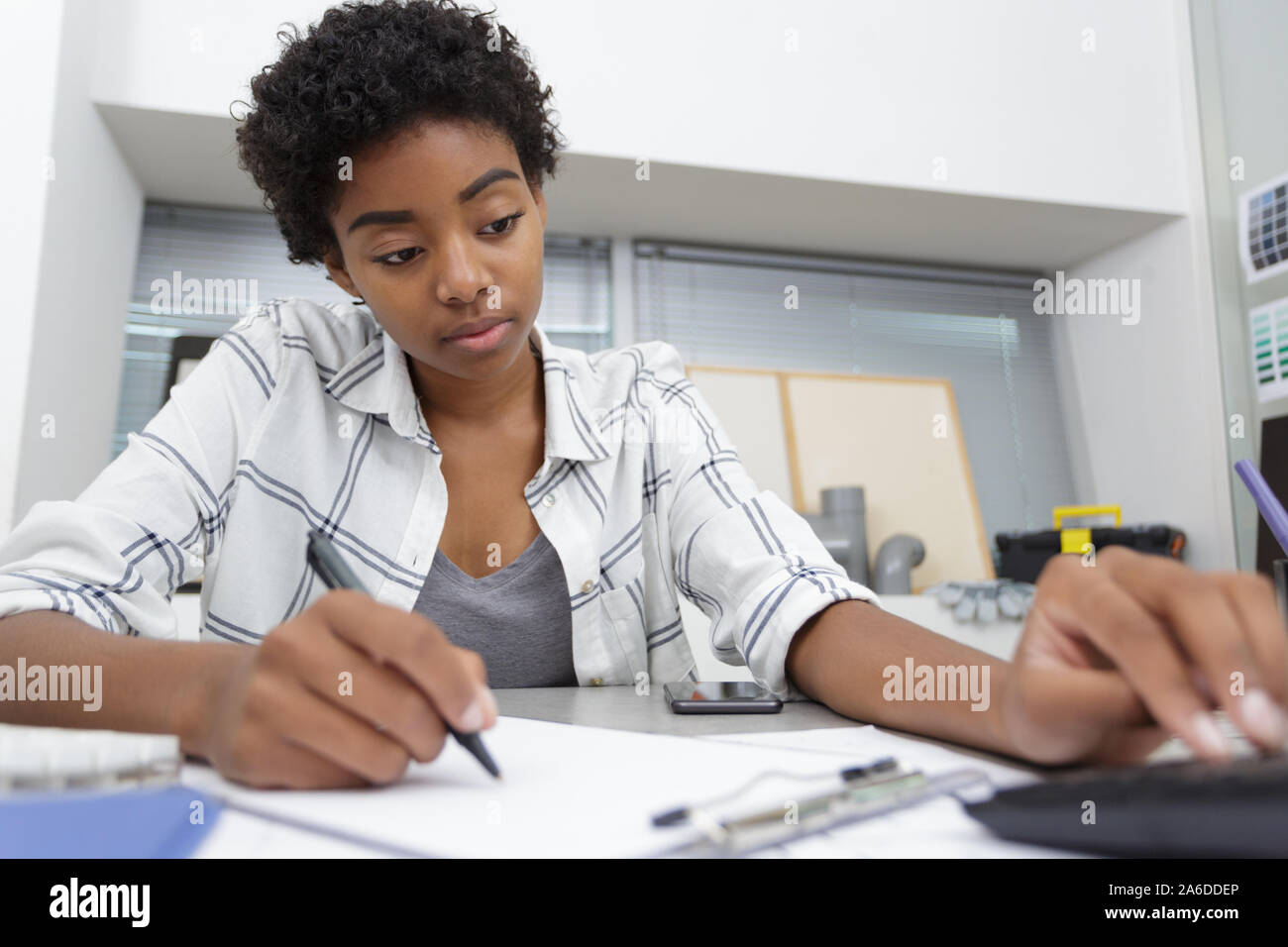 student notes on notebook while learning online study Stock Photo - Alamy