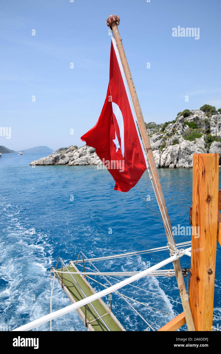Turkey flag at the stern of a pleasure yacht. View of the Mediterranean ...