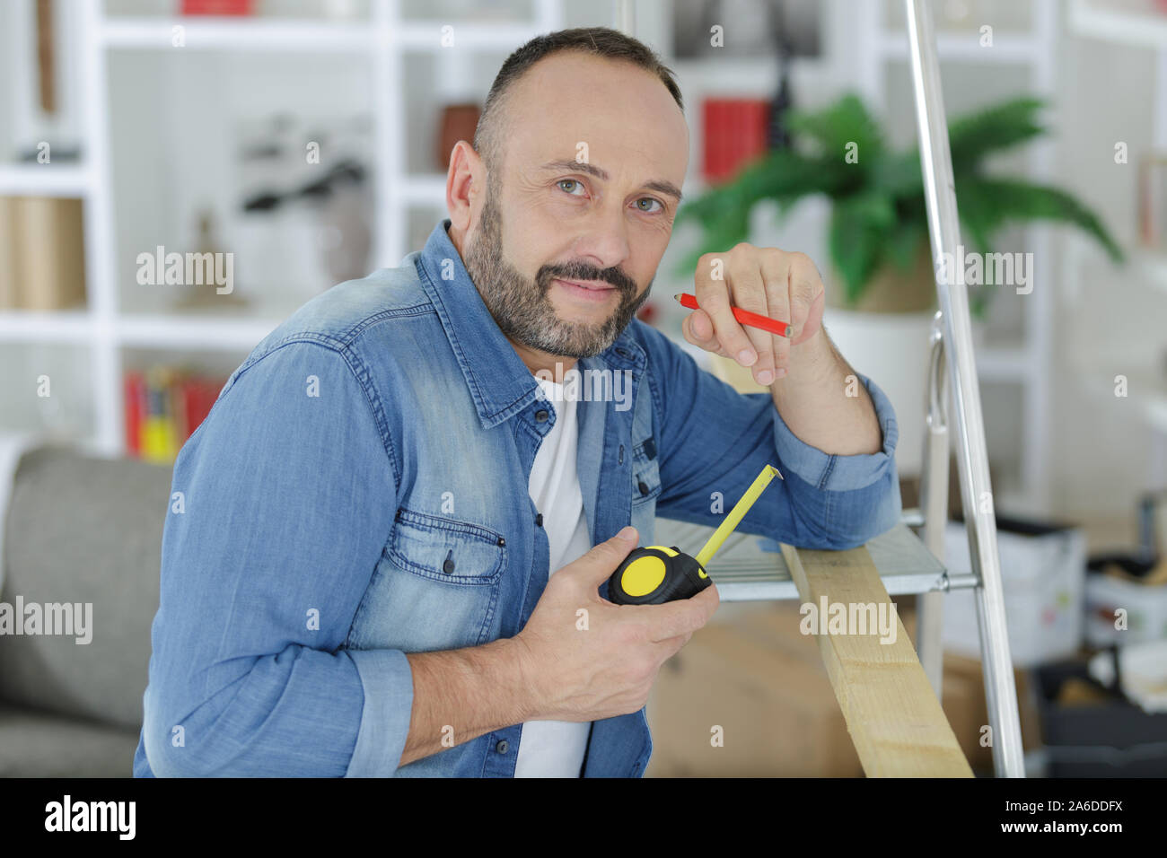 Male hands measures measuring tape hi-res stock photography and images ...