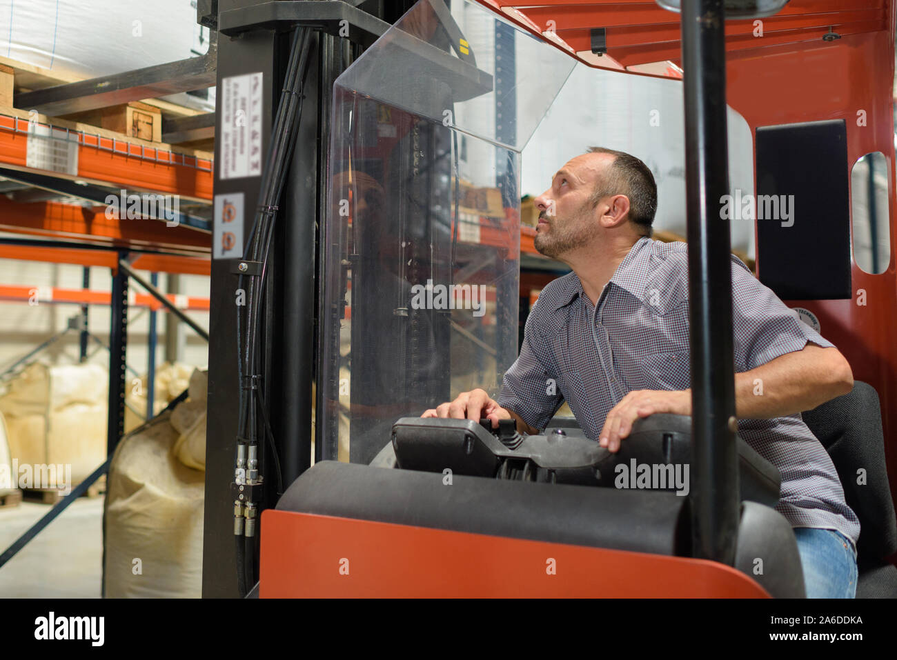 warehouse forklift operator at work Stock Photo - Alamy